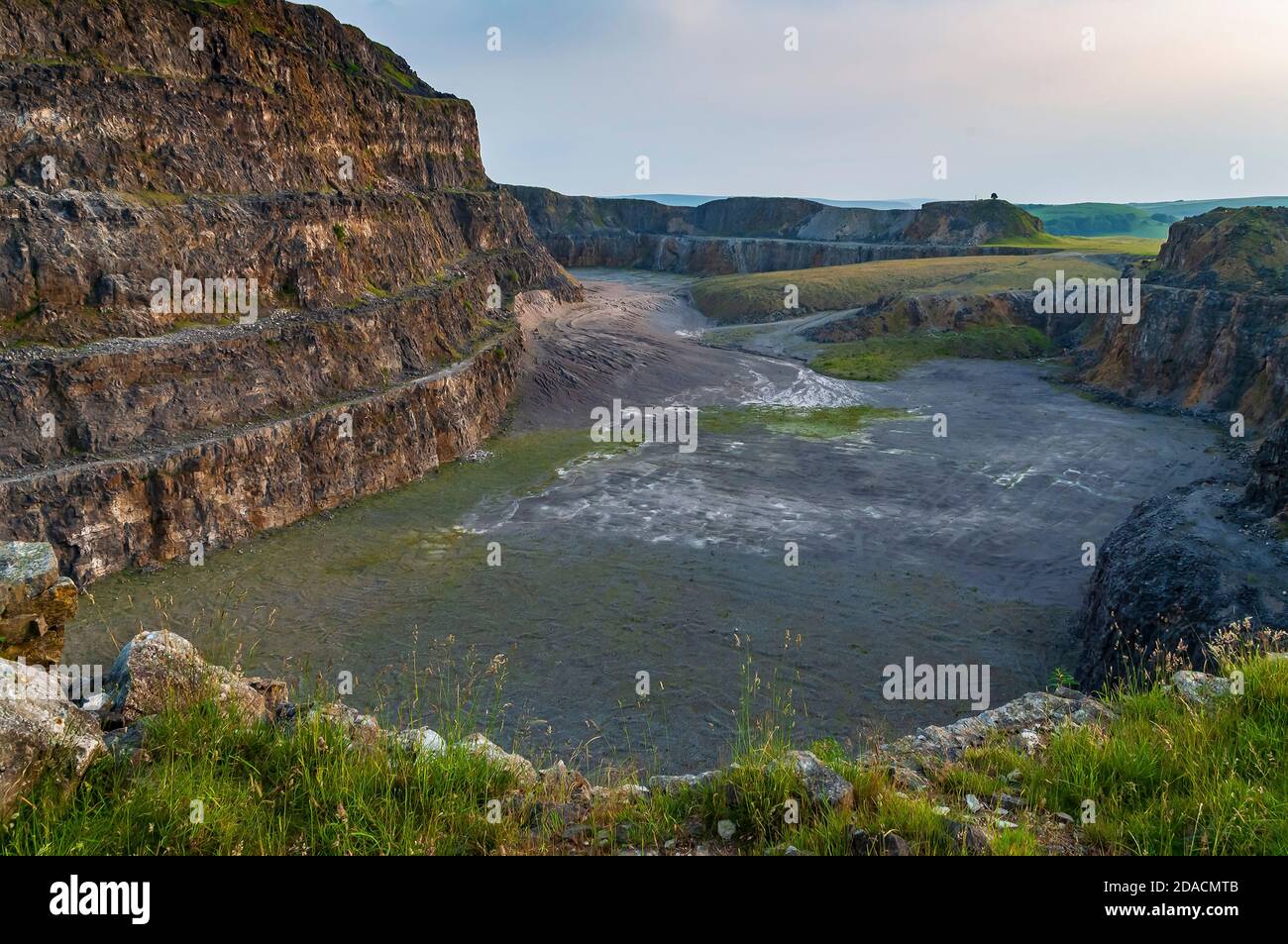 Steep benches of excavated limestone in the abandoned Eldon HIll Quarry ...