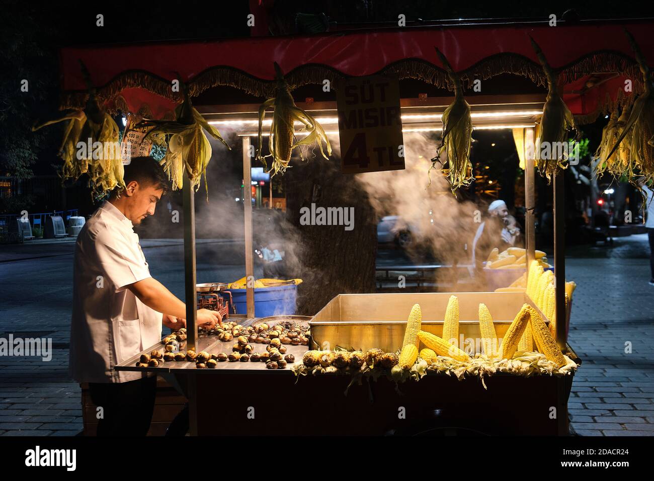 Toasted corn on the cob and roasted chestnuts mobile stall at night ...