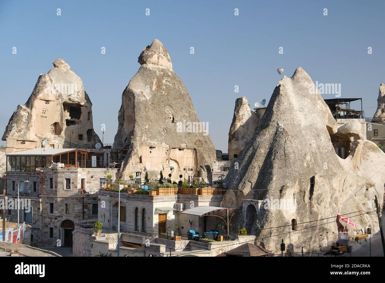 View of boutique cave hotels and patio built from fairy chimney ruins ...