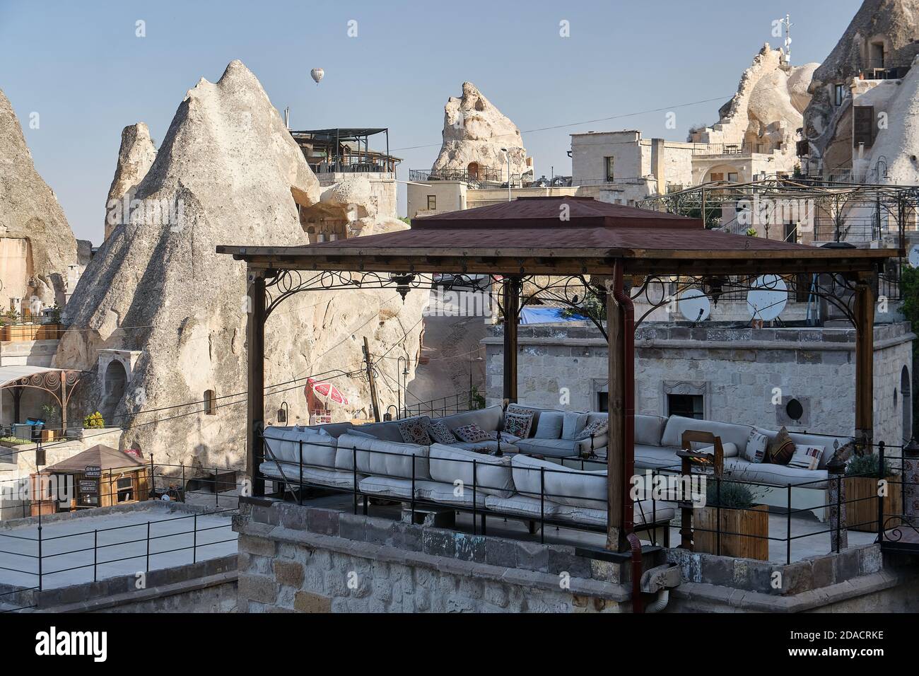View of boutique cave hotels and patio built from fairy chimney ruins ...