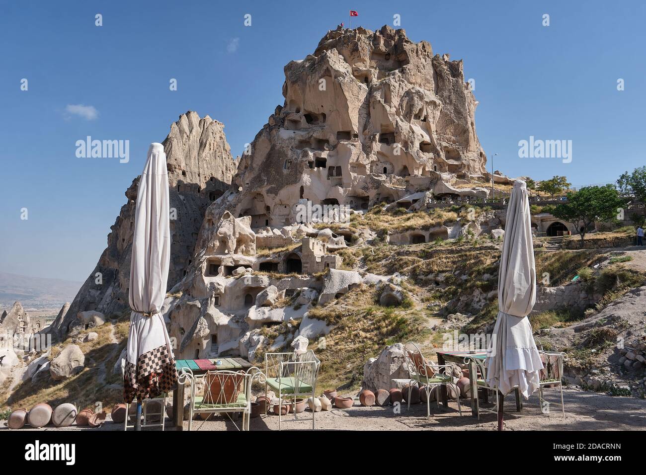 View of Uchisar Castle and its numerous rock windows with a Turkish ...