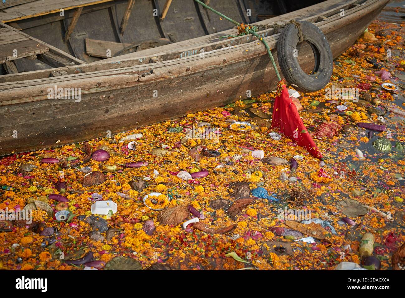 Varanasi, India, November 2015. Remains of flowers and garbage in the ...