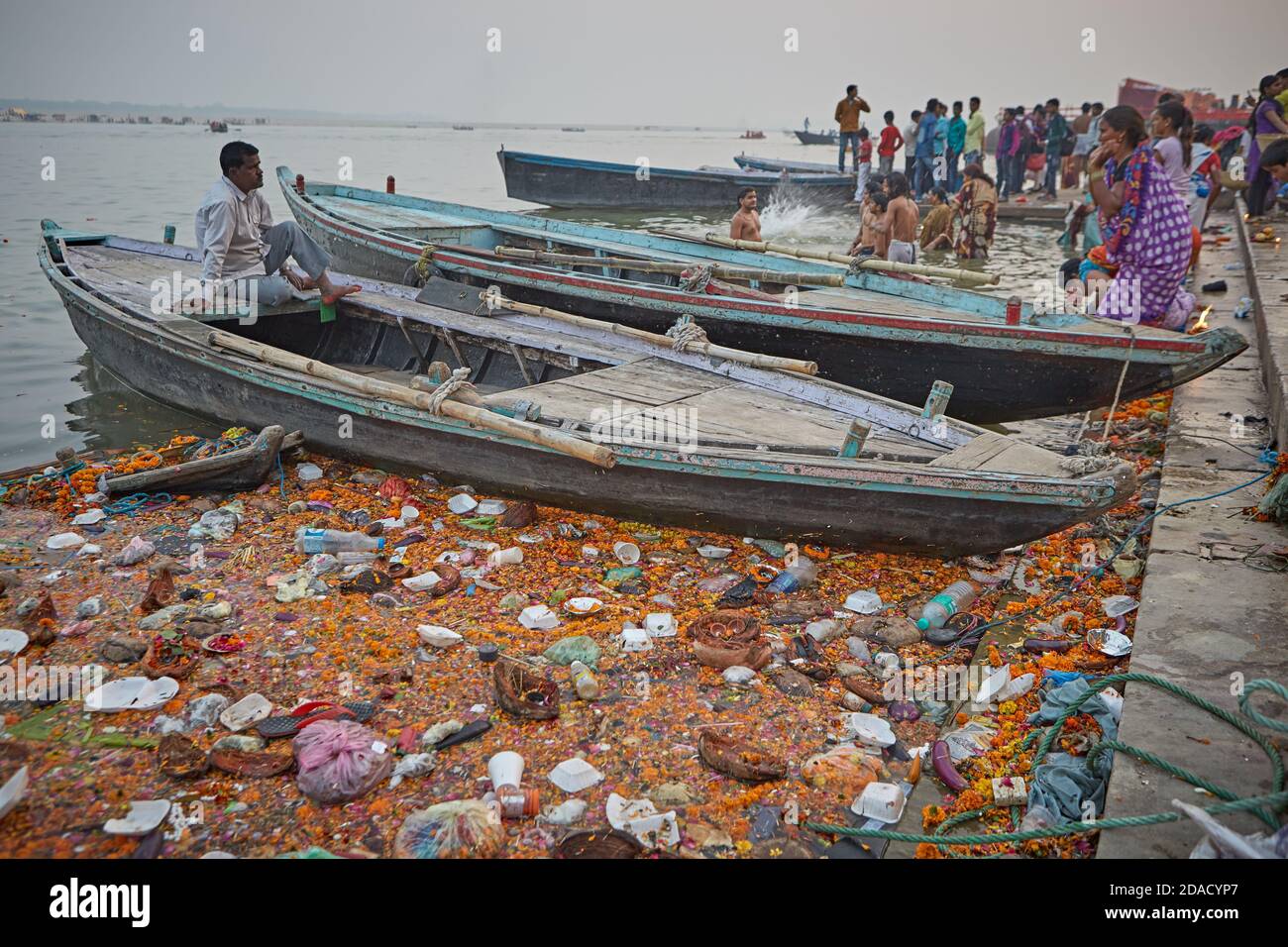 Varanasi, India, November 2015. Remains of flowers and garbage in the ...