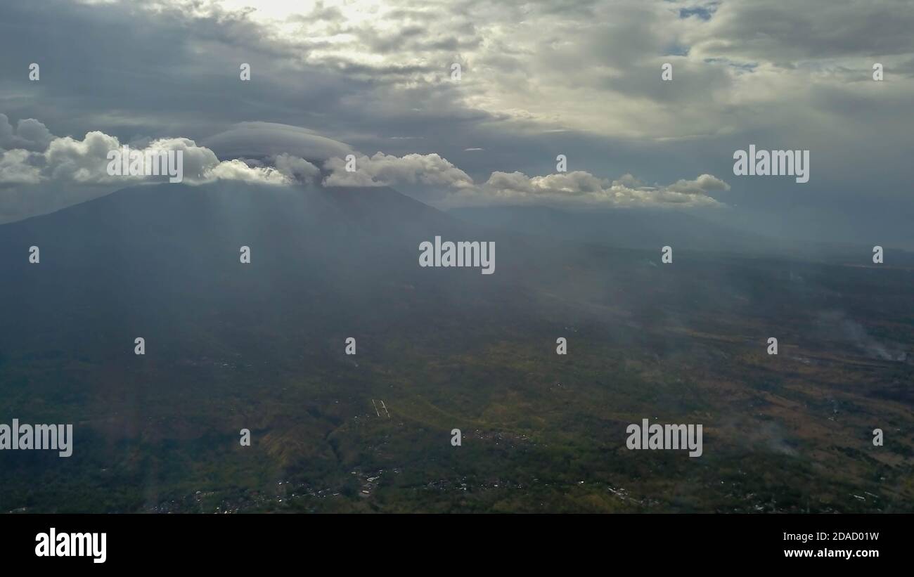 volcano with cloudy clear sky. Mount Merapi in Indonesia. Cloudy sky ...