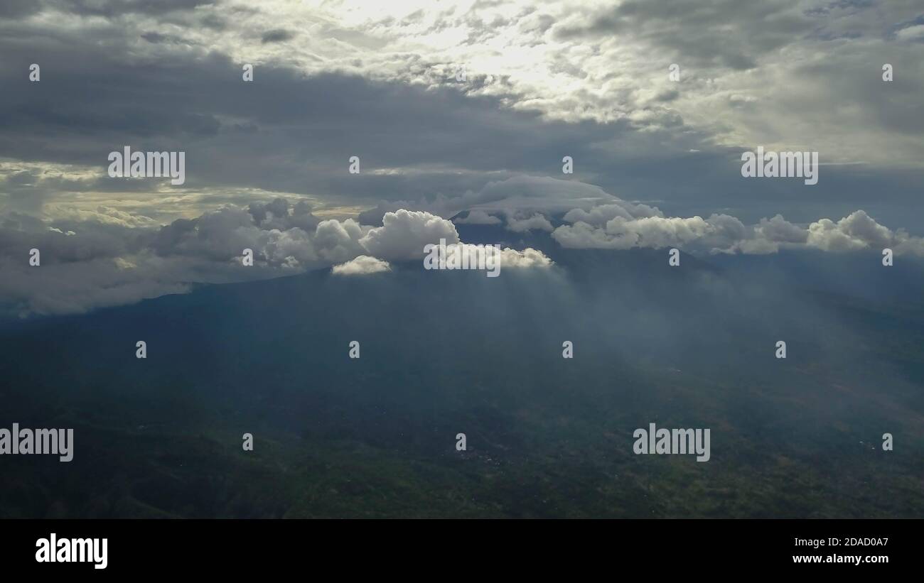 volcano with cloudy clear sky. Mount Merapi in Indonesia. Cloudy sky ...