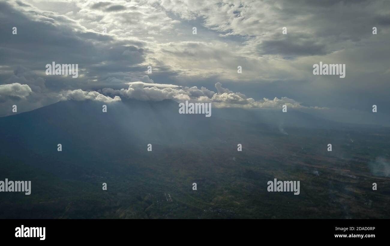 volcano with cloudy clear sky. Mount Merapi in Indonesia. Cloudy sky ...