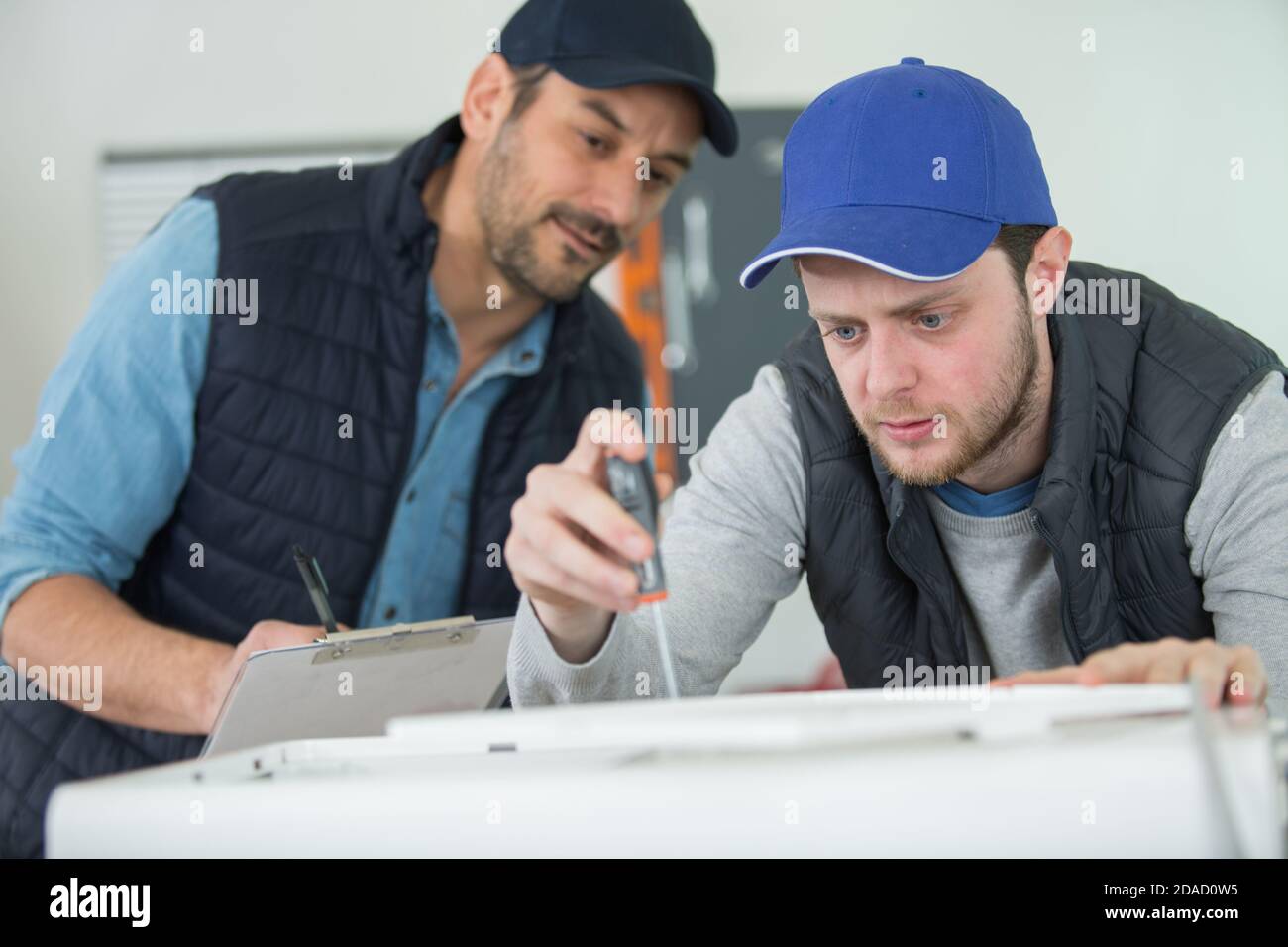 workers in a workshop together Stock Photo - Alamy