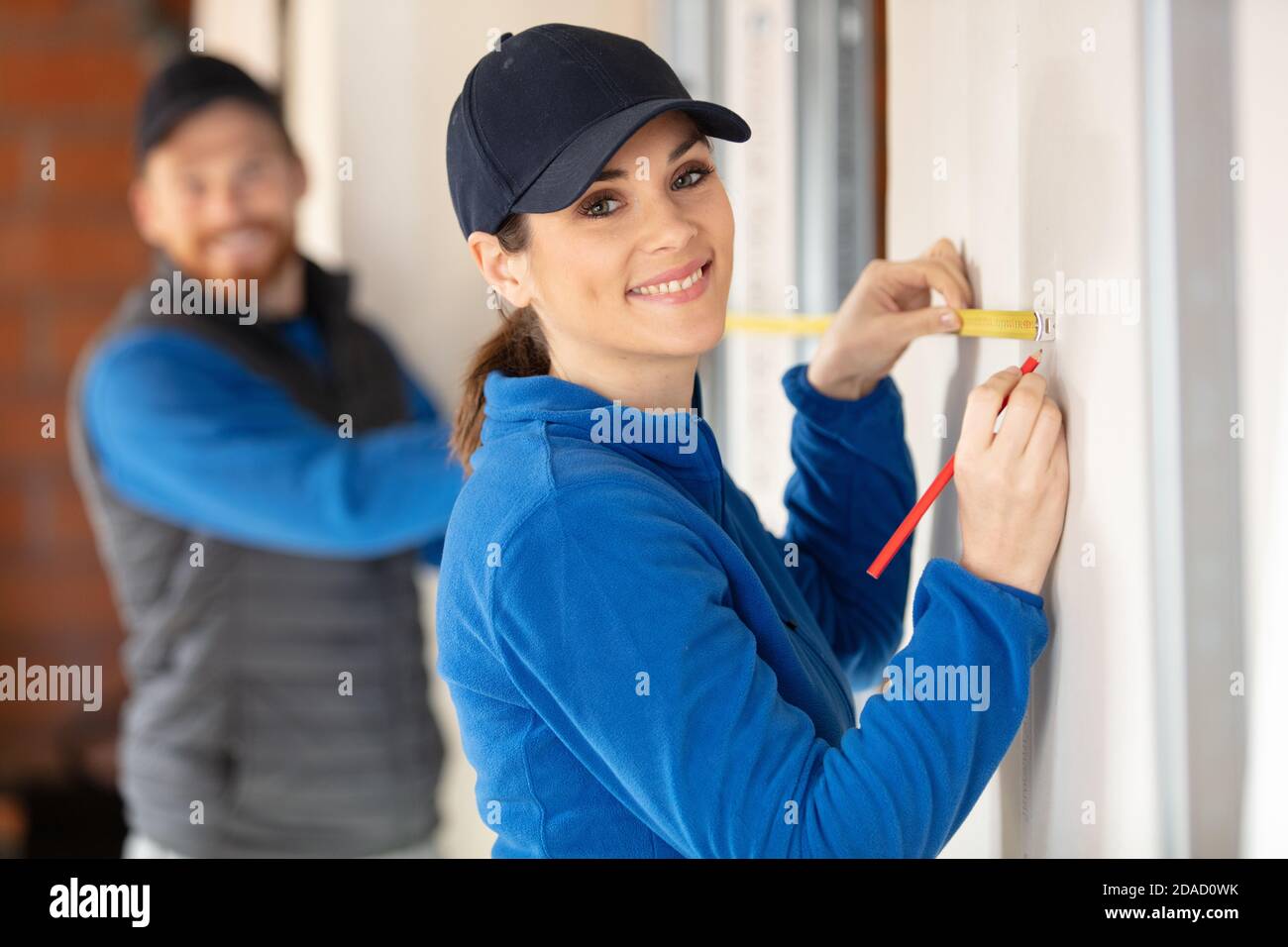 male female builders working indoors at building site Stock Photo - Alamy