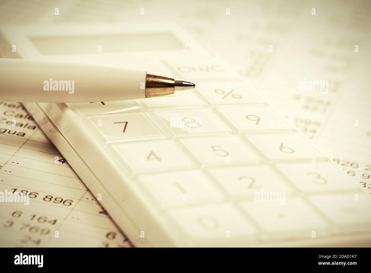 Financial accounting Pen and calculator on balance sheets Stock Photo ...