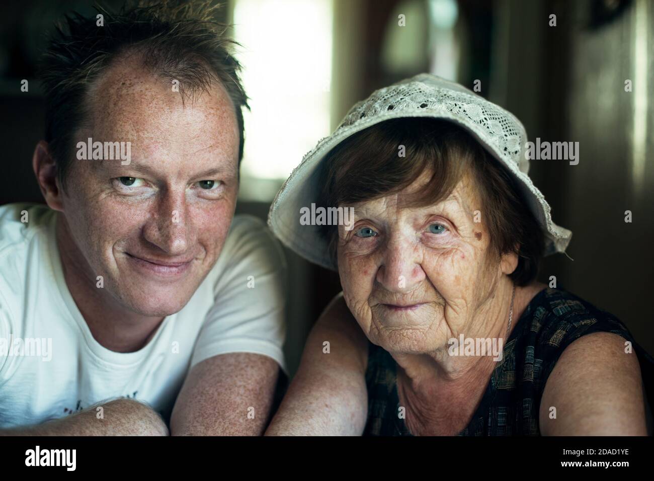 Portrait of man with his old grandmother Stock Photo - Alamy