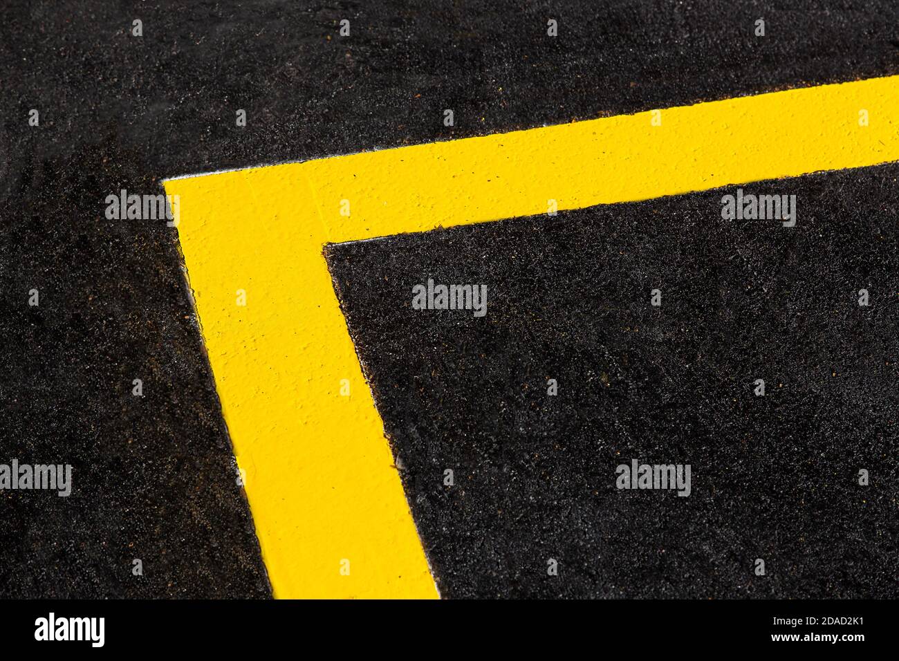 yellow markings angle of the new highway with tarmac road surface close ...