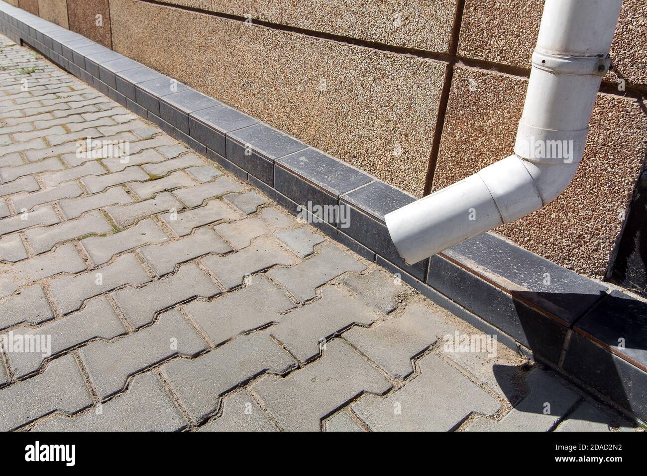 building roof drainage rain pipe with granular tar pavement wall and ...