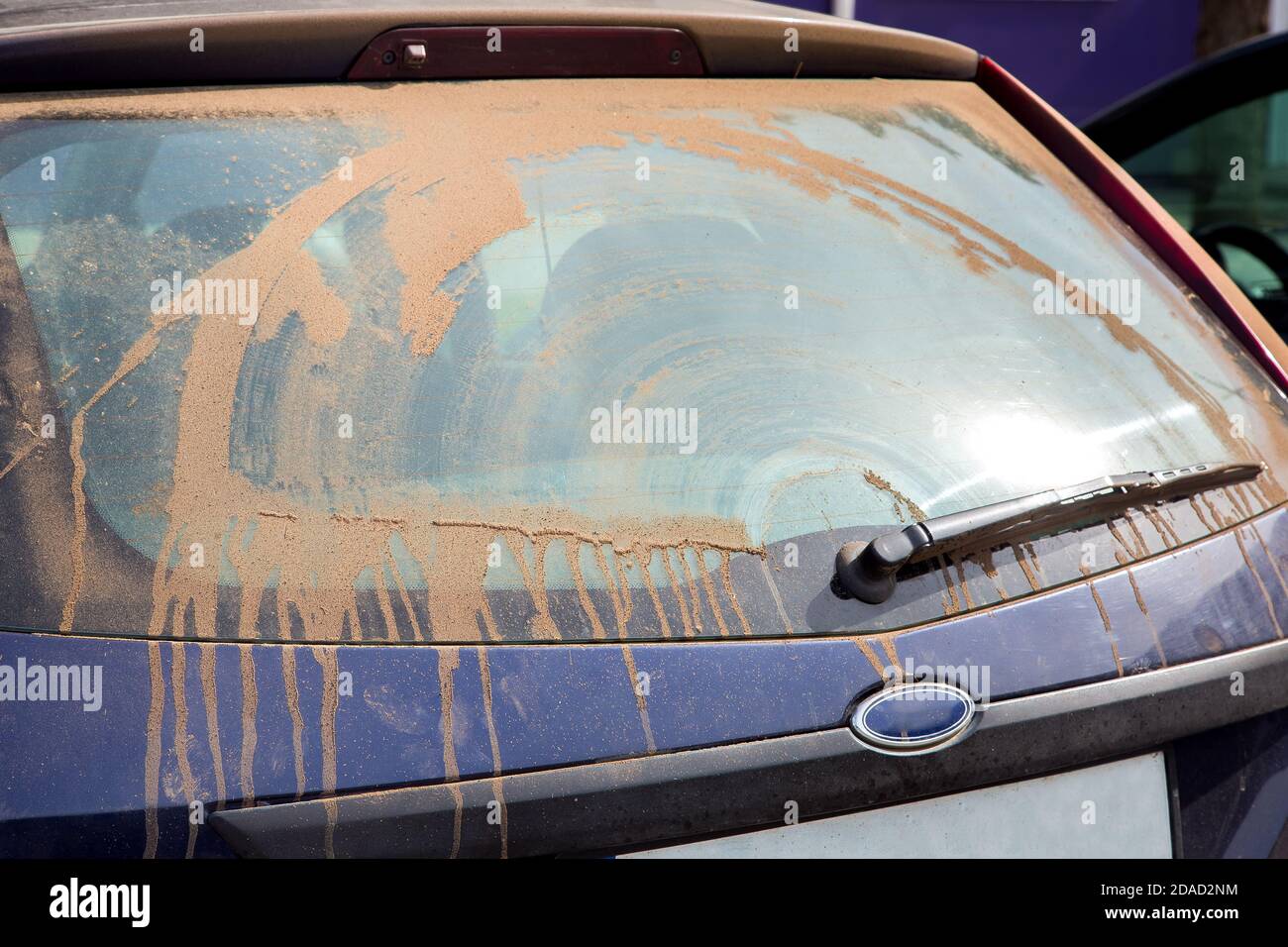 dirty car suv covered with a dry layer of dust from soil smeared with a ...