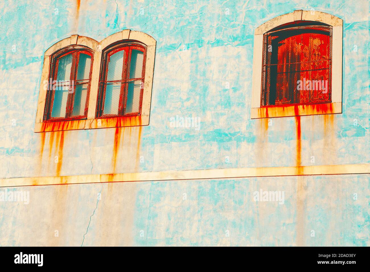 Old style windows with rusty frame at cyan wall Stock Photo - Alamy