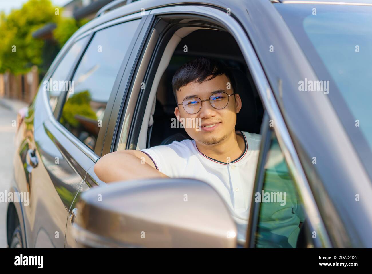 Asian businessman driving car hi-res stock photography and images - Alamy