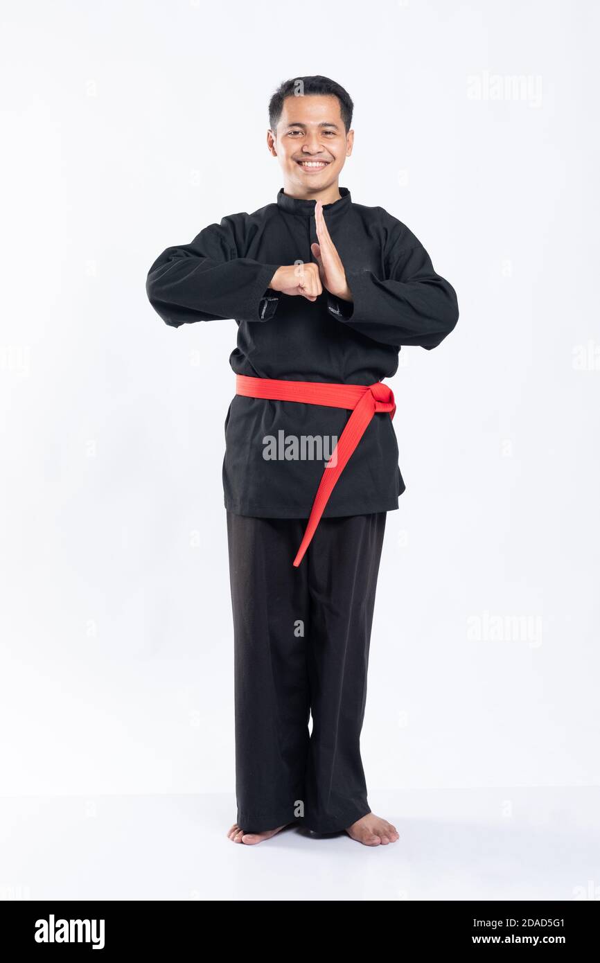 men standing and smiling wearing pencak silat uniforms stand up with ...