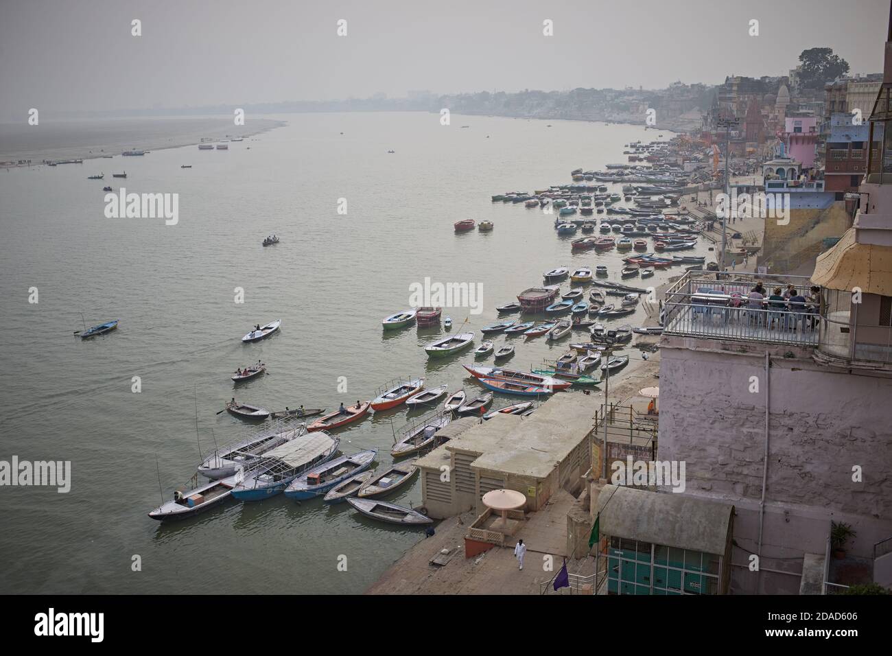 Varanasi, India, November 2011. Aerial view of a terrace with tourists ...