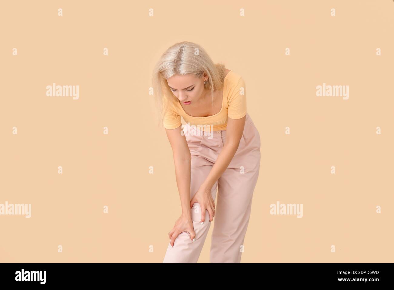 Woman with problem of limbs numbness on color background. Diabetes ...