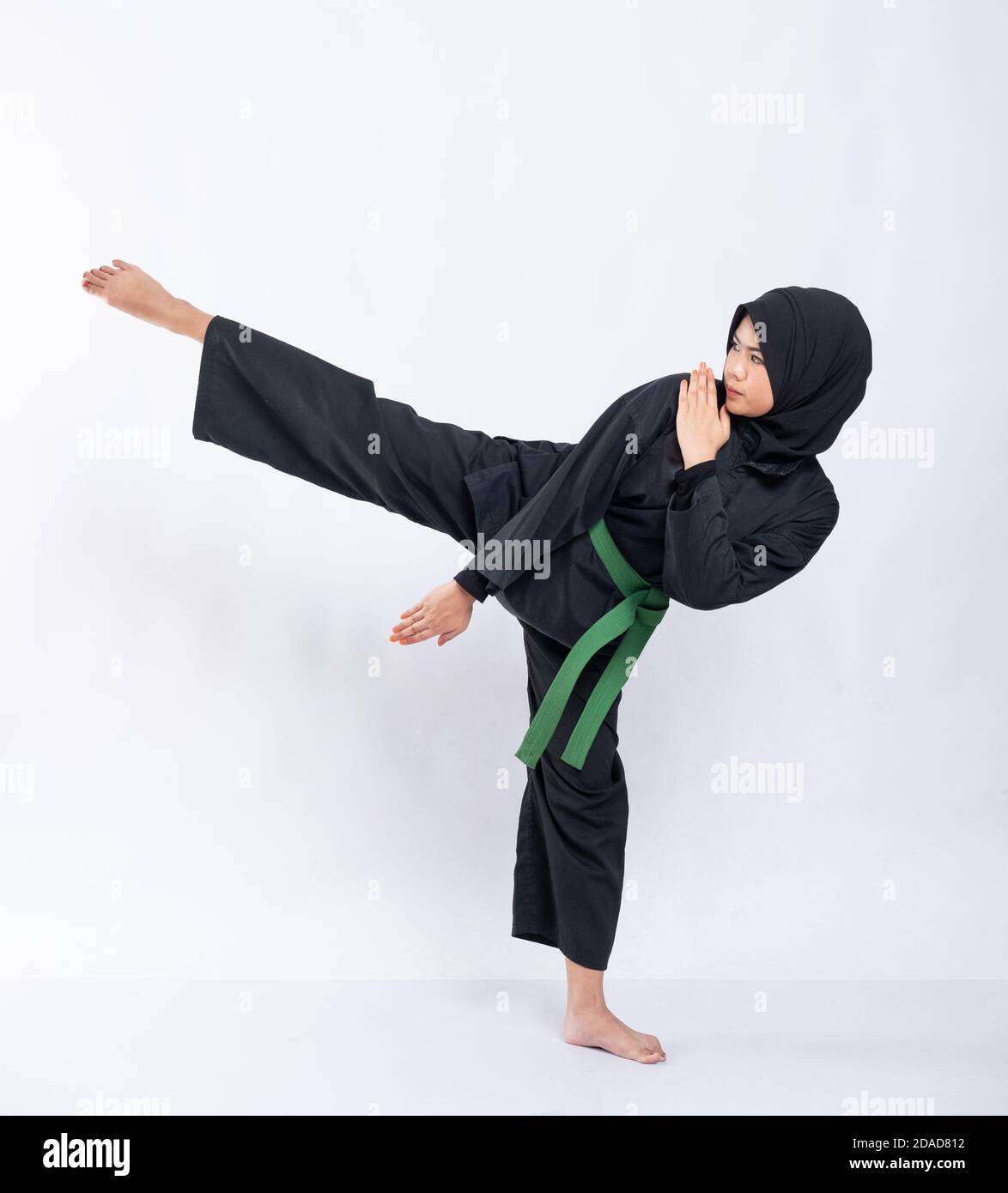 young woman wear pencak silat sports uniforms to fight on a white ...
