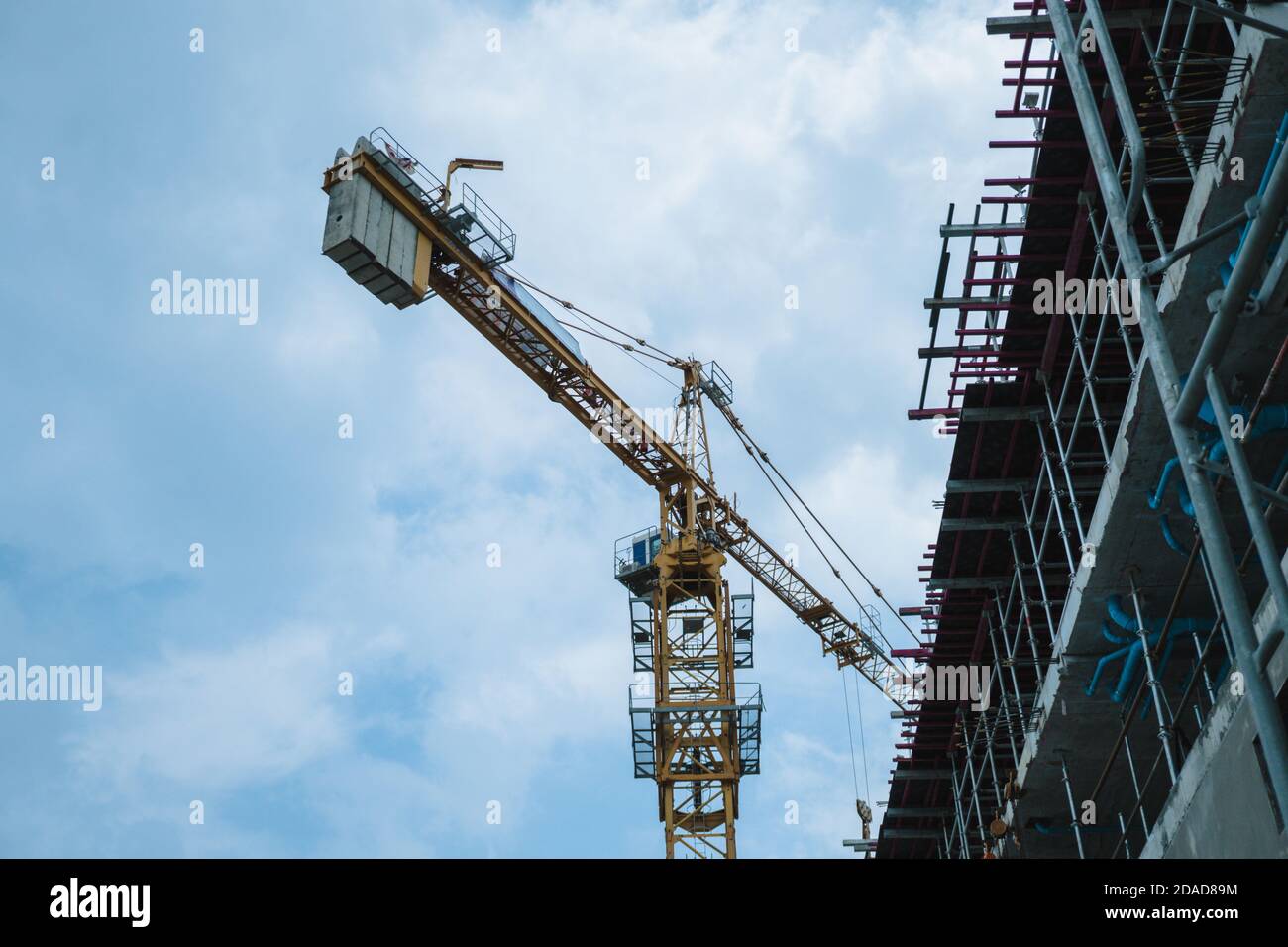 Building construction with crane Stock Photo - Alamy