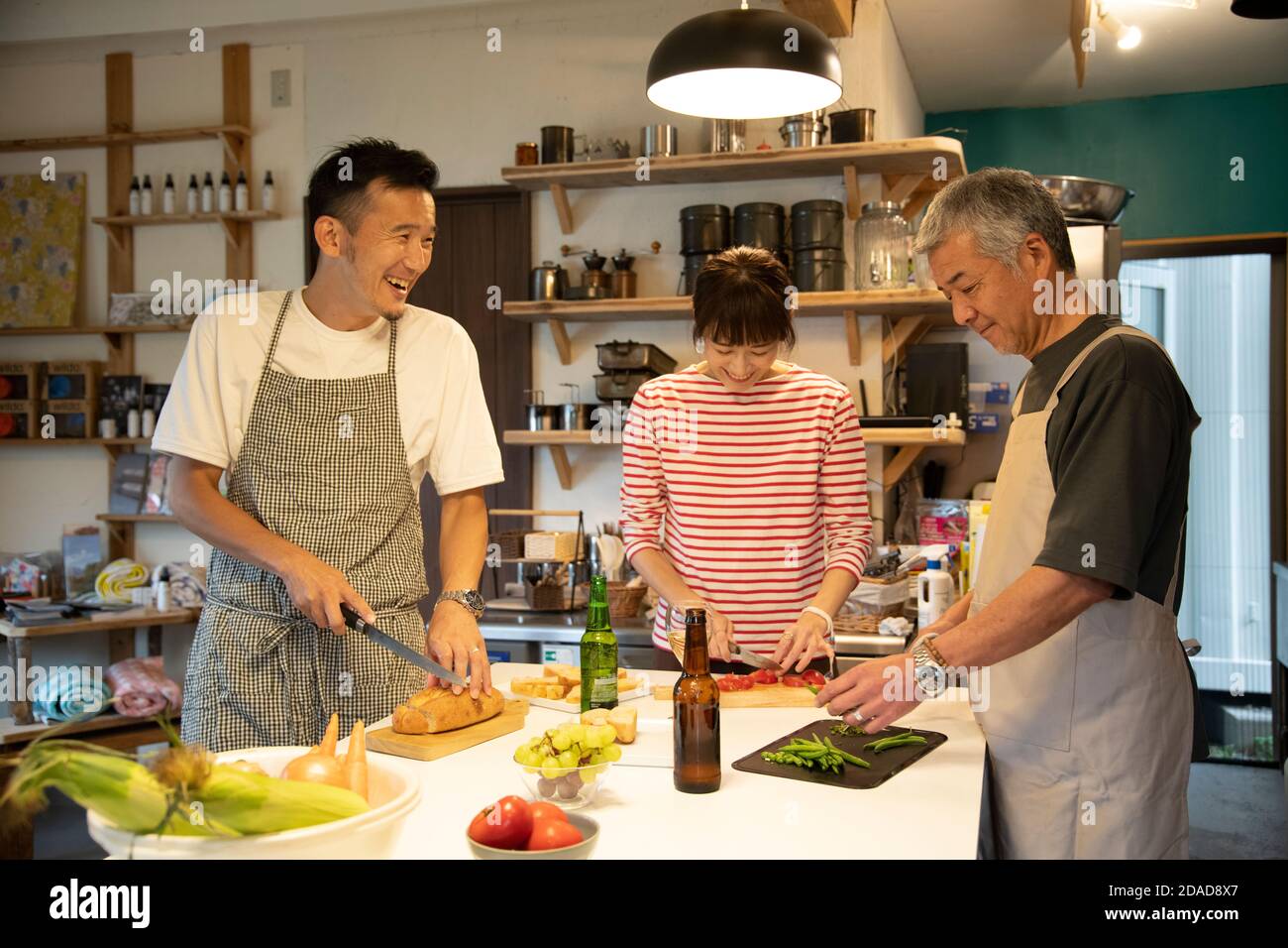Men and Woman Cooking in the Shared Kitchen Stock Photo - Alamy