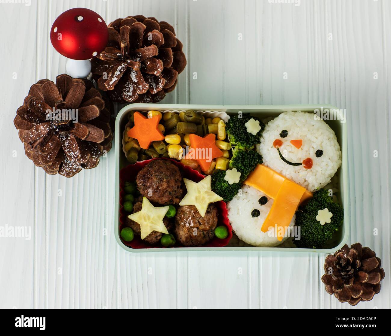 Holiday lunch bento box with snowman for kids over white background and ...
