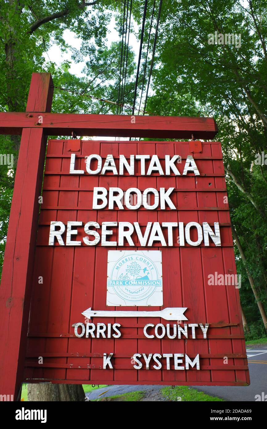 The wooden sign board of Loantaka Brook Reservation by the park ...