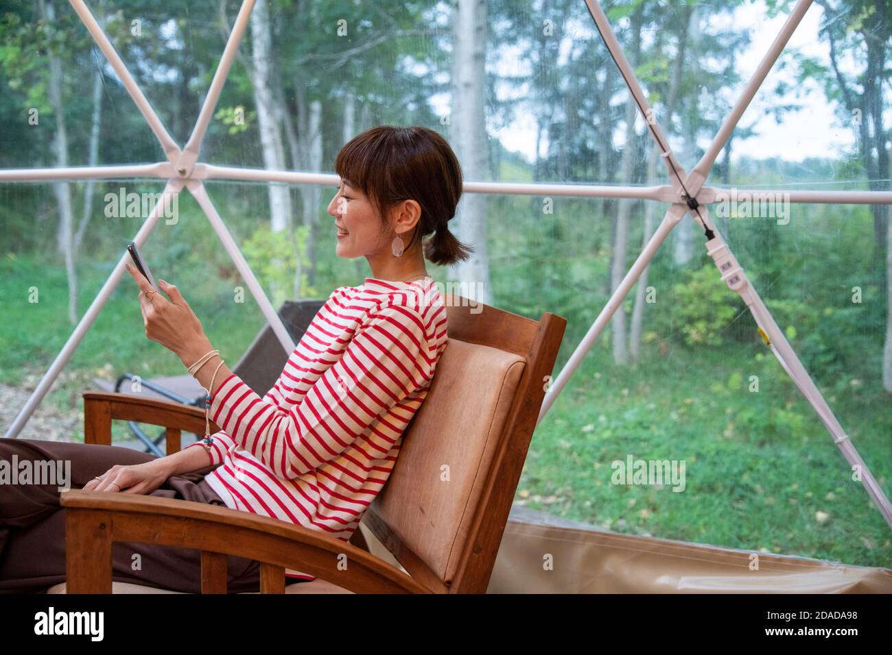 Woman in the Glamping Dome Stock Photo - Alamy