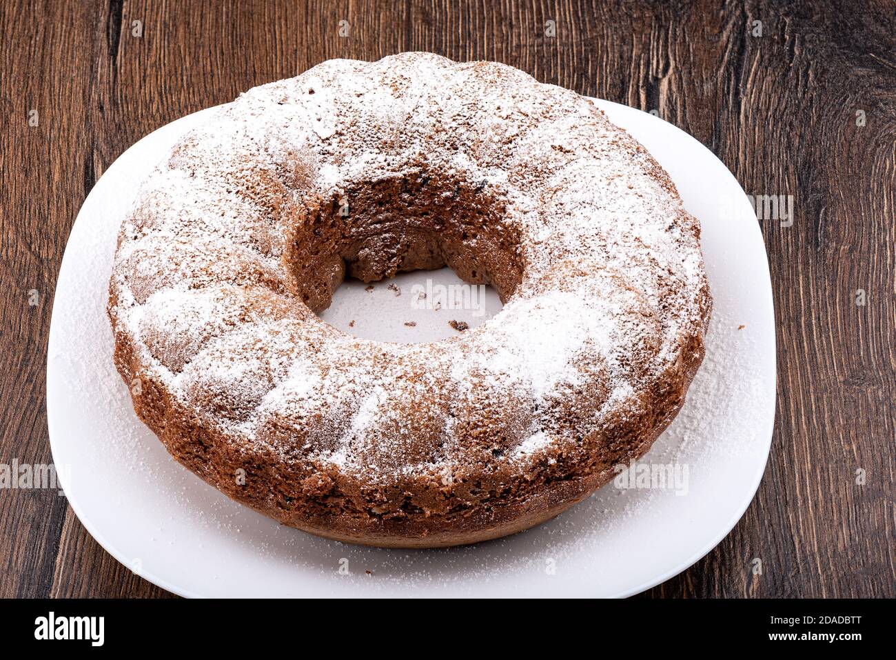 A ring-shaped cupcake sprinkled with powdered sugar Stock Photo - Alamy