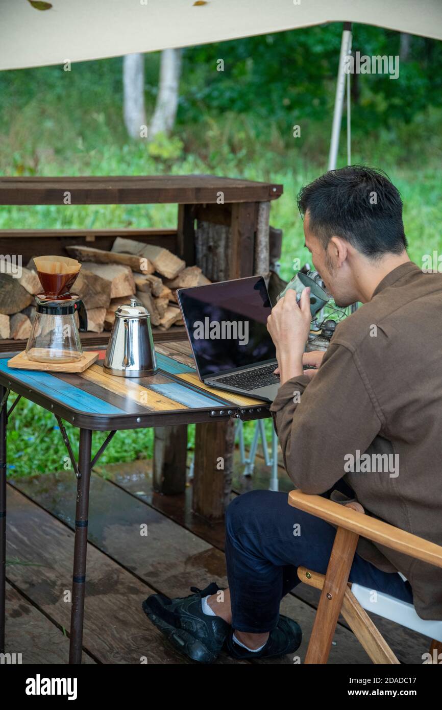 Work on Vacation as New Normal Work Style Stock Photo - Alamy