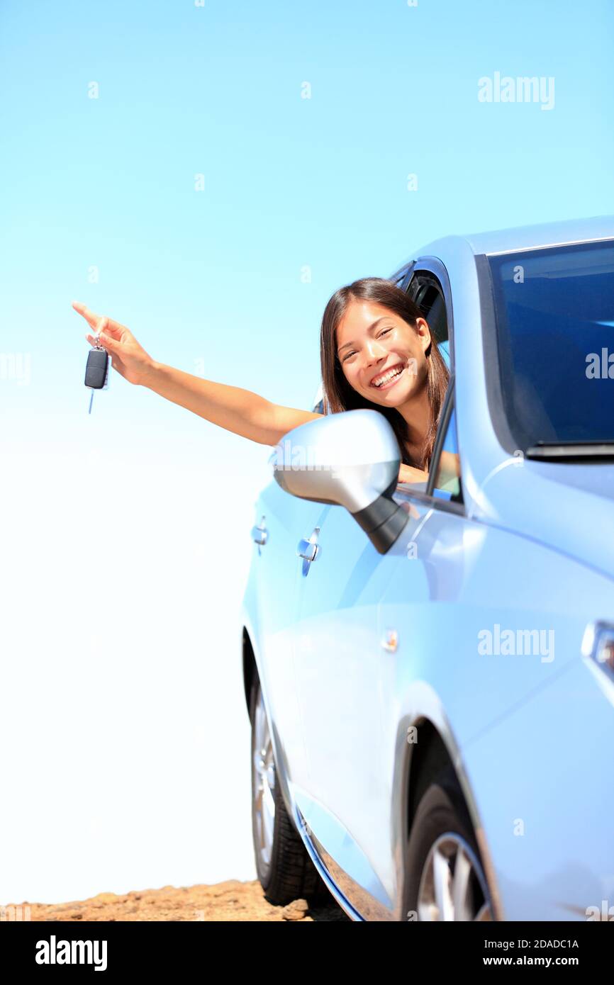 Car woman showing keys Stock Photo - Alamy