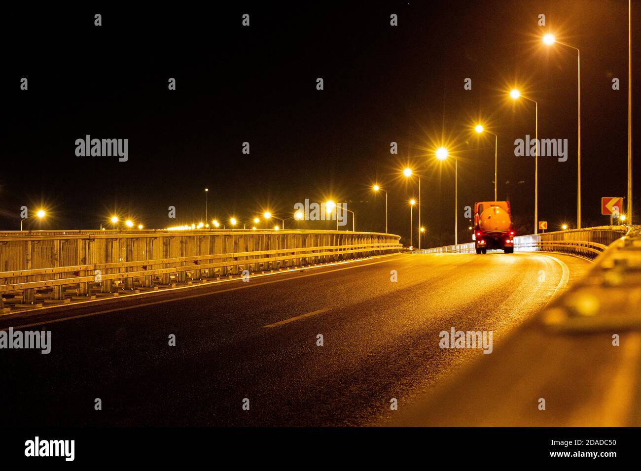 Night street lit by lanterns, some city lights in the distance Stock ...