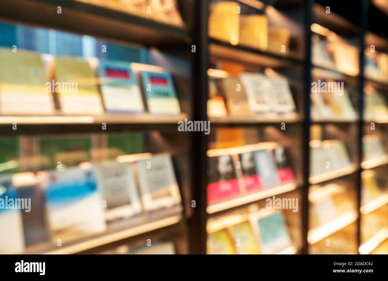 Blurred books in public library. Blur effect. Background Stock Photo ...