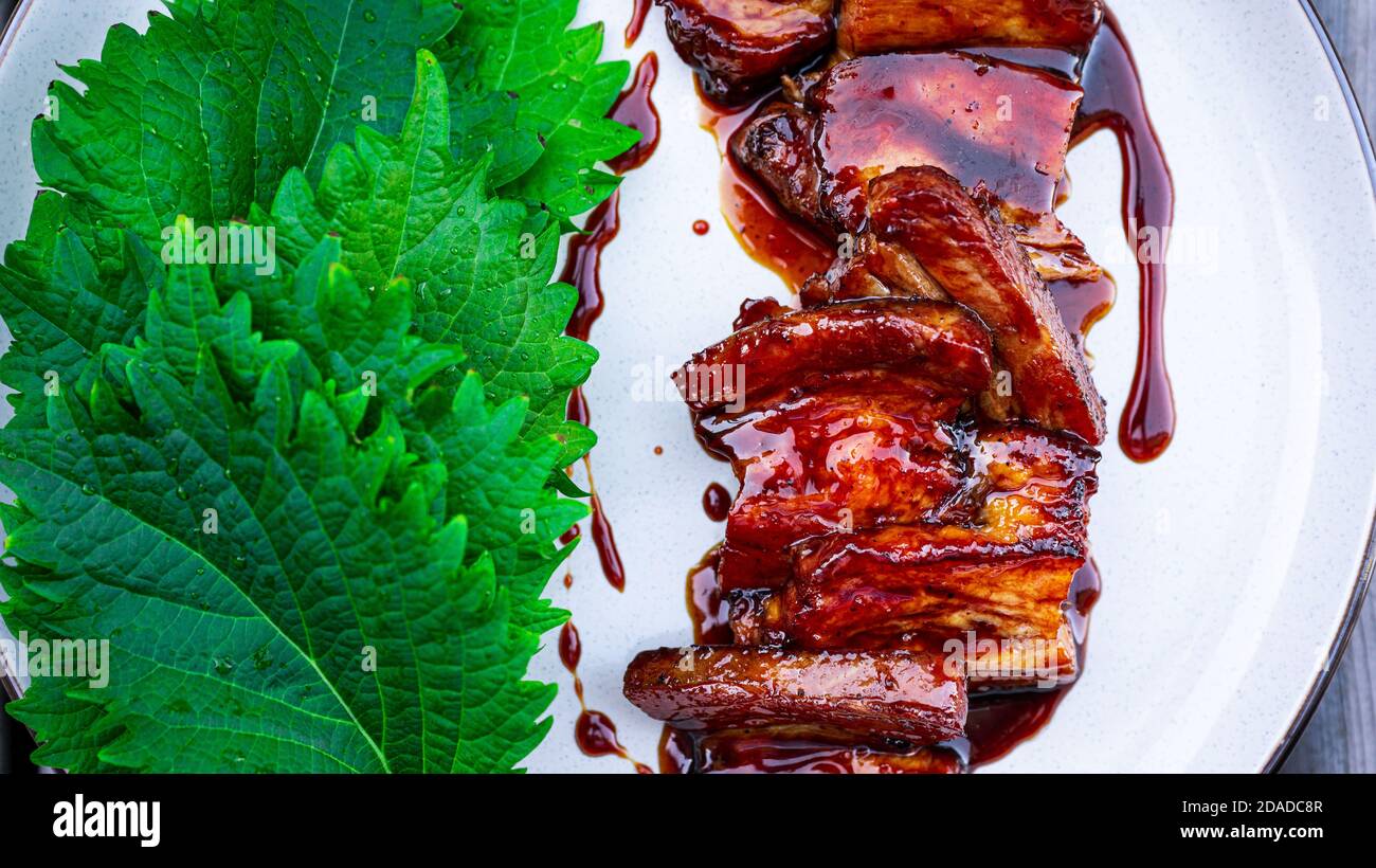 Shiso leaves and glazed pork belly Stock Photo - Alamy