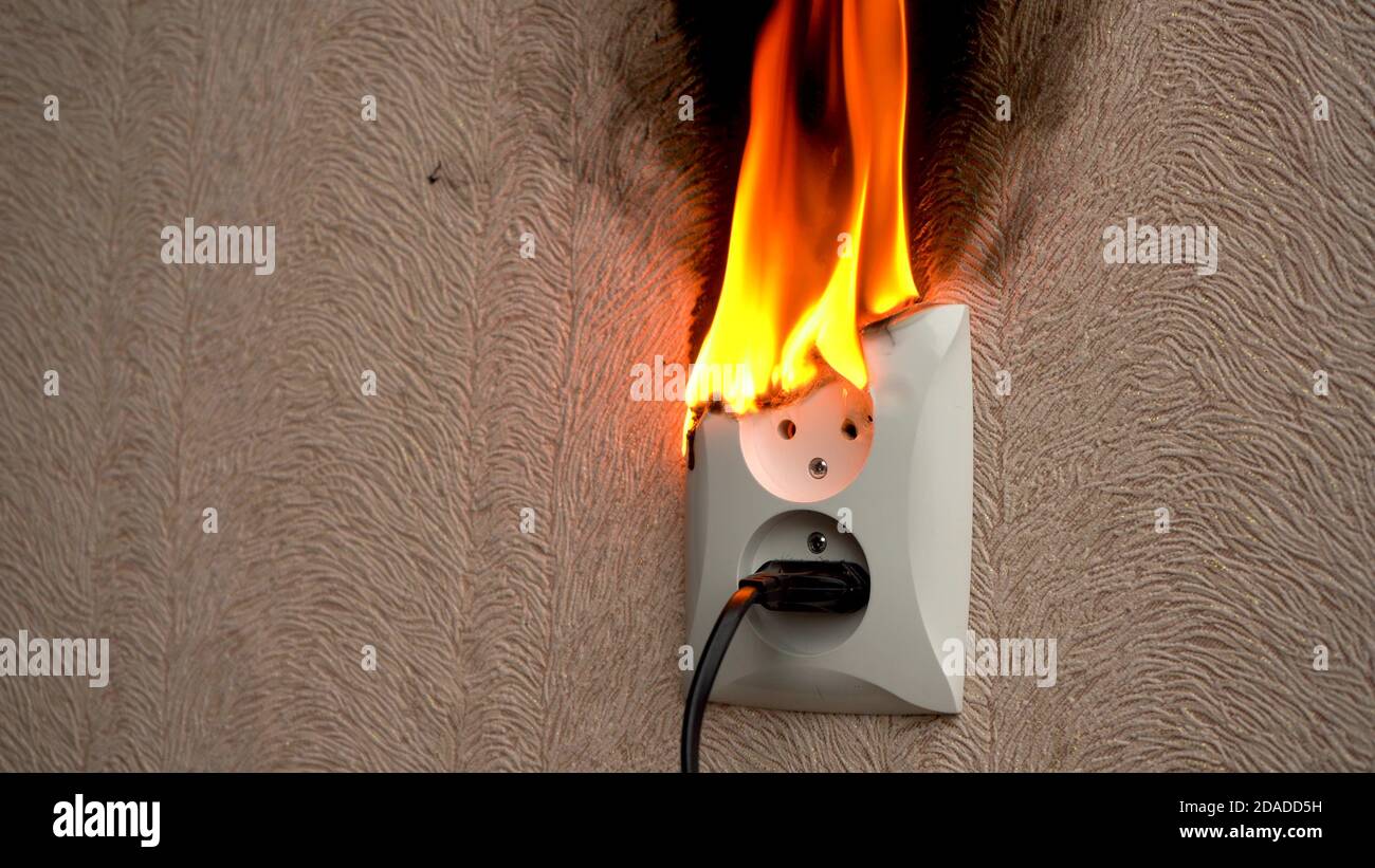 Fire caused by short circuit. The concept of a fire in the house Stock ...