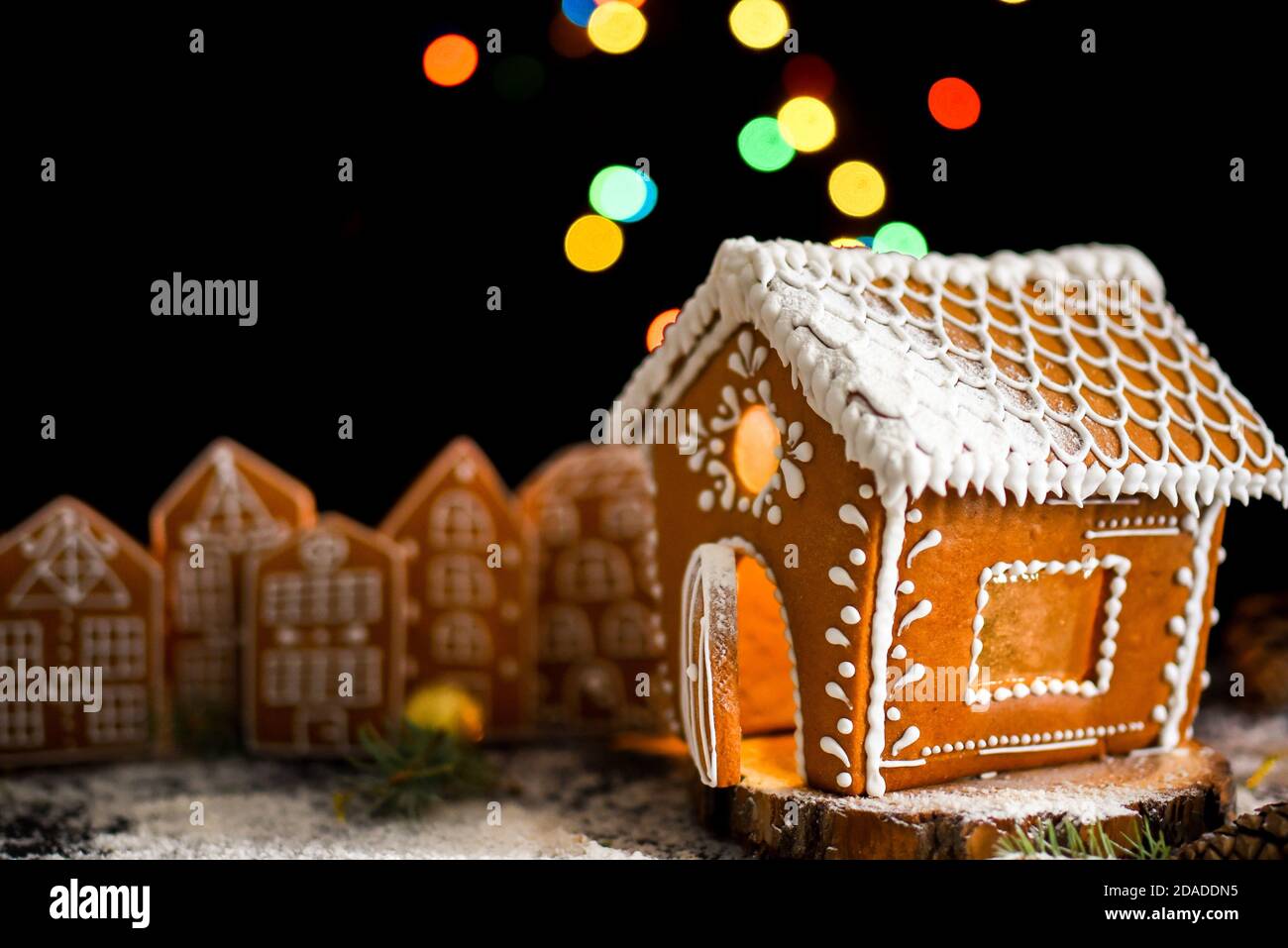 Winter gingerbread house with light from the windows, gingerbread city ...
