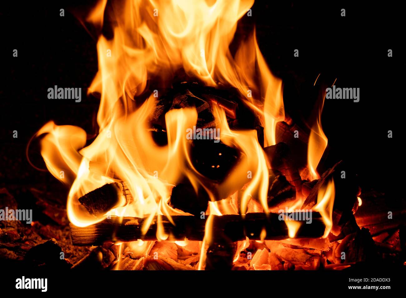 Hot fireplace full of wood. Real Flames from burning logs texture ...