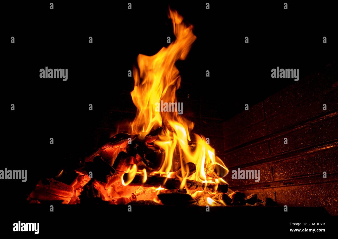 Hot fireplace full of wood. Real Flames from burning logs texture ...