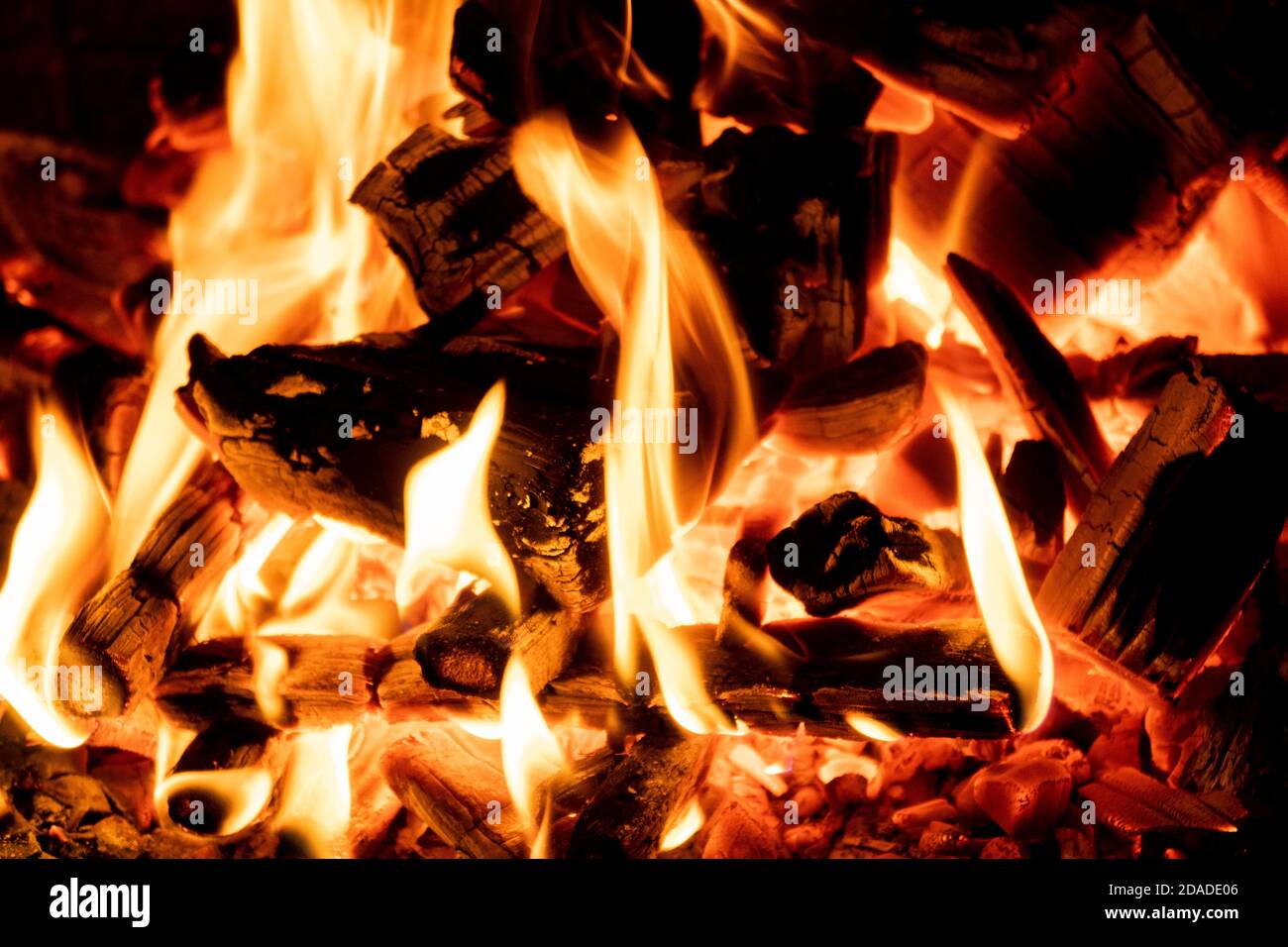 Hot fireplace full of wood. Real Flames from burning logs texture ...