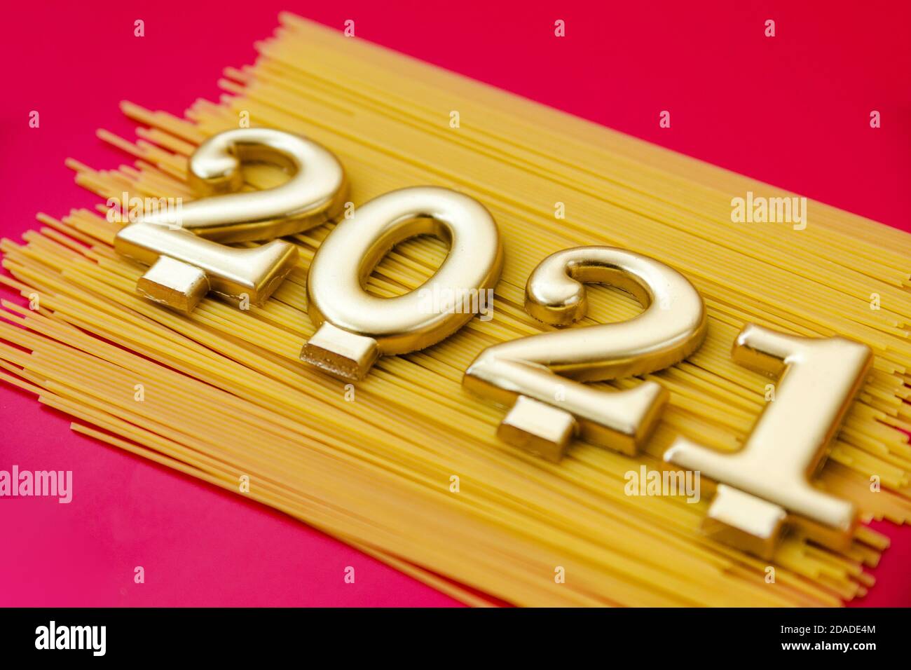 Happy New Year 2021. Symbol from number 2021 and macaroni on red ...