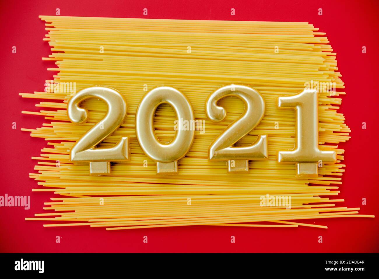 Happy New Year 2021. Symbol from number 2021 and macaroni on red ...