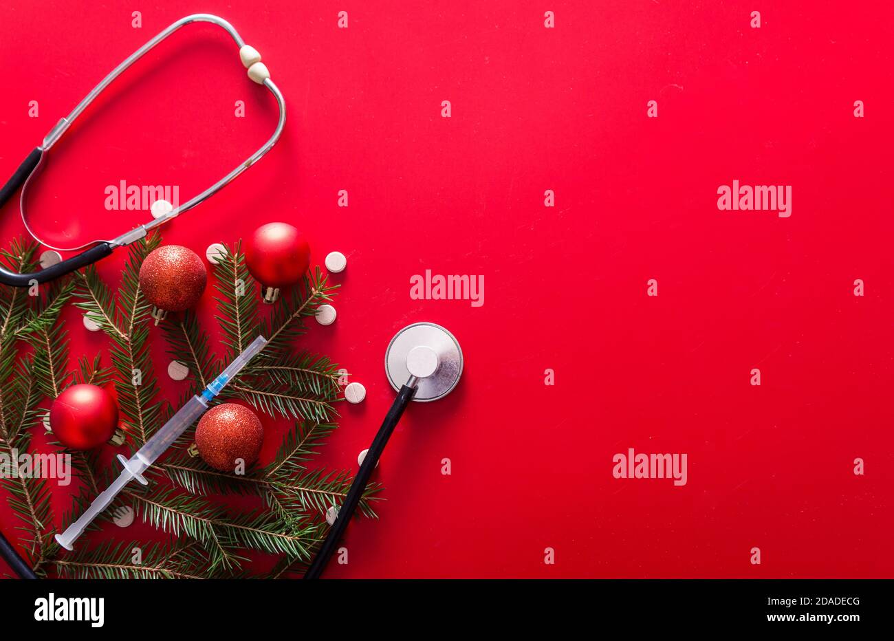 Stethoscope, syringe, pills, Christmas tree branch and new year red ...