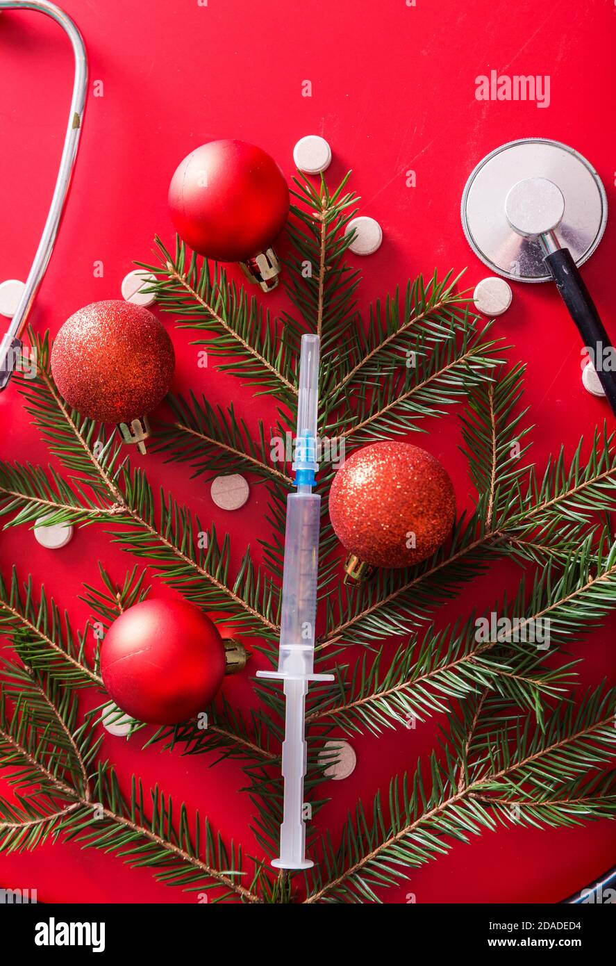 Stethoscope, syringe, pills, Christmas tree branch and new year red ...