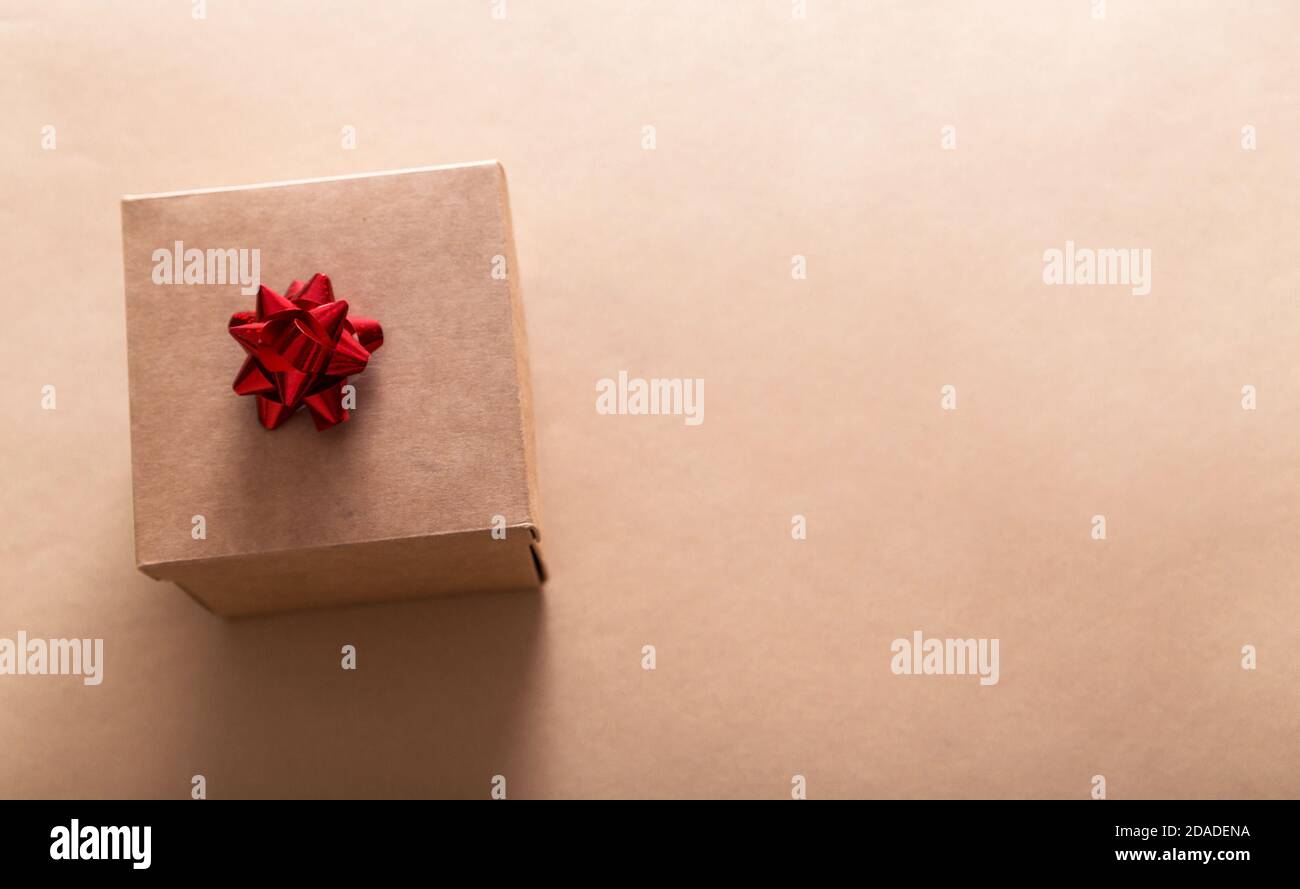Gift in craft packaging on craft paper background Stock Photo - Alamy