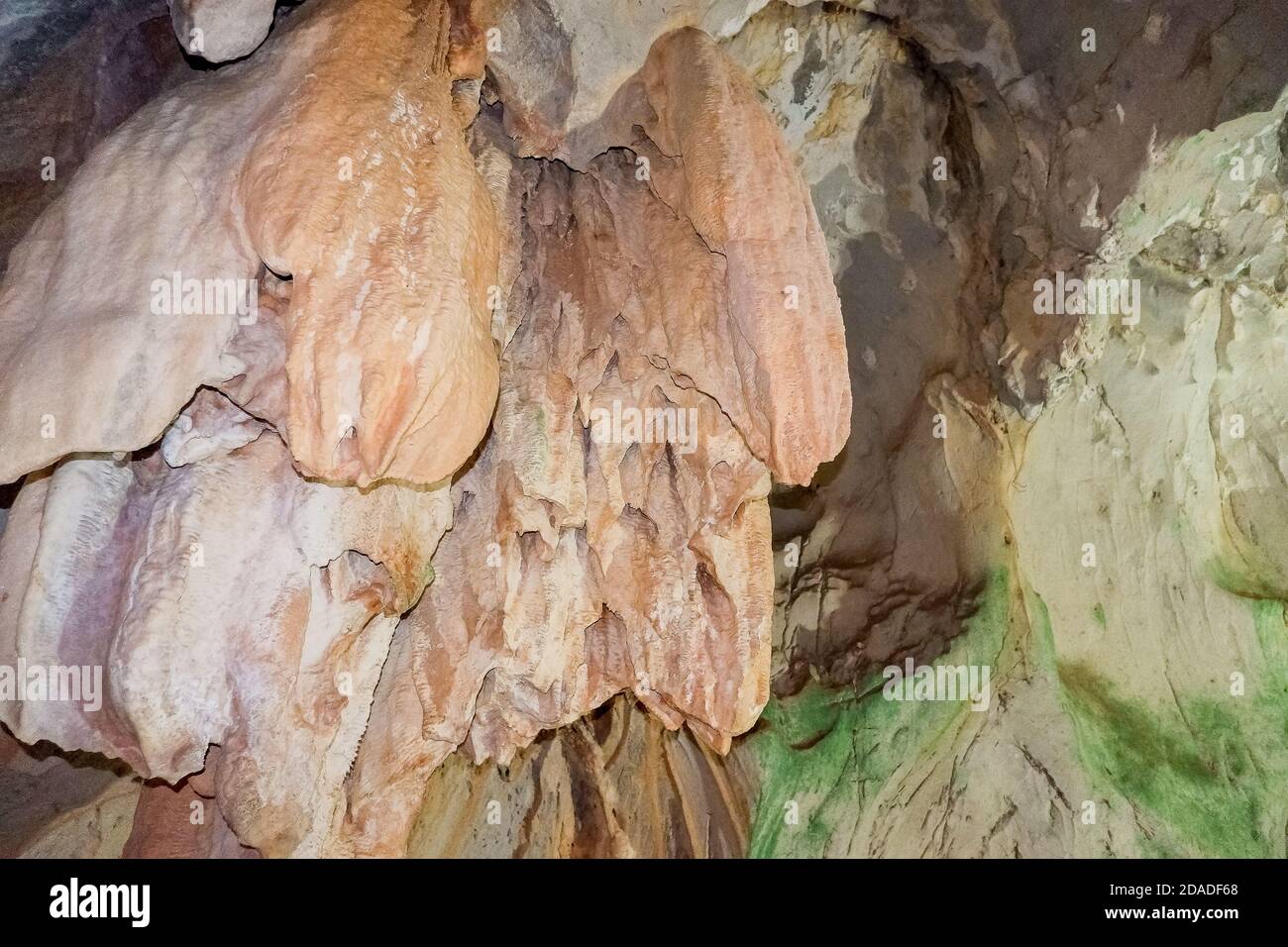 tourist cave .High arches of a huge stone cave with round holes at the ...