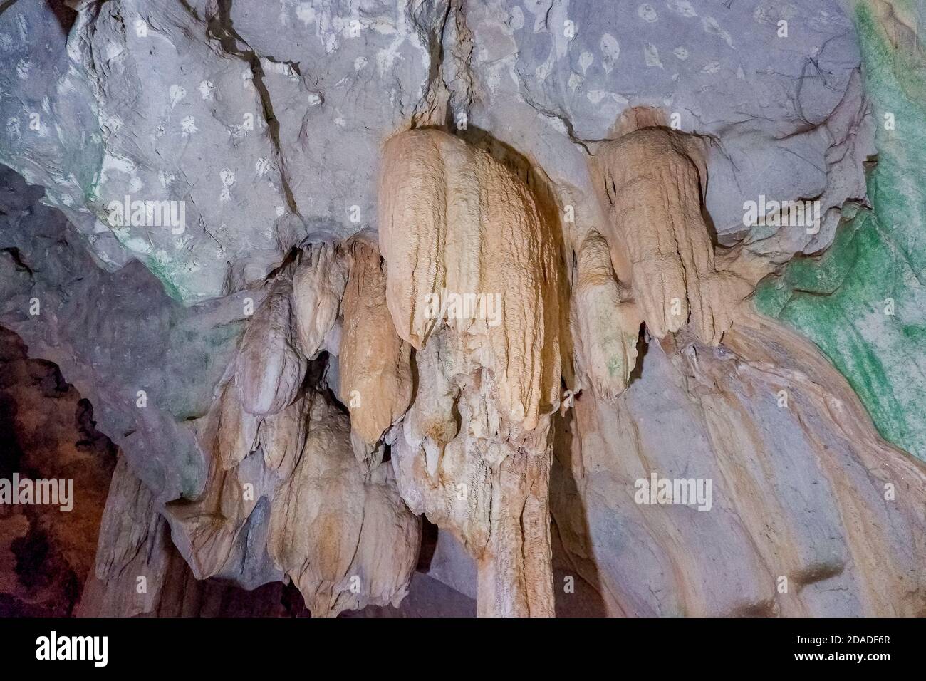 tourist cave .High arches of a huge stone cave with round holes at the ...