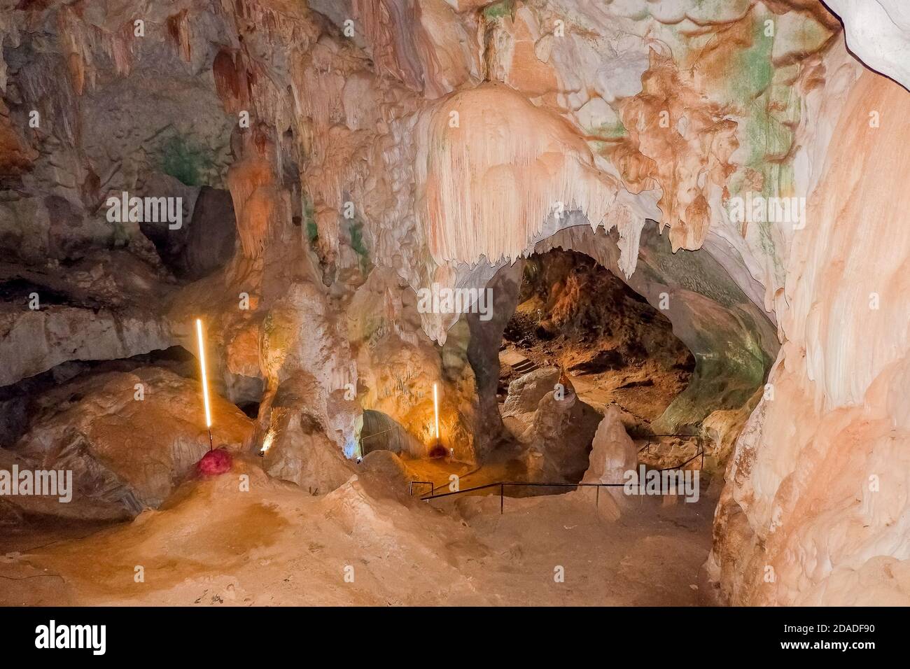 tourist cave .High arches of a huge stone cave with round holes at the ...