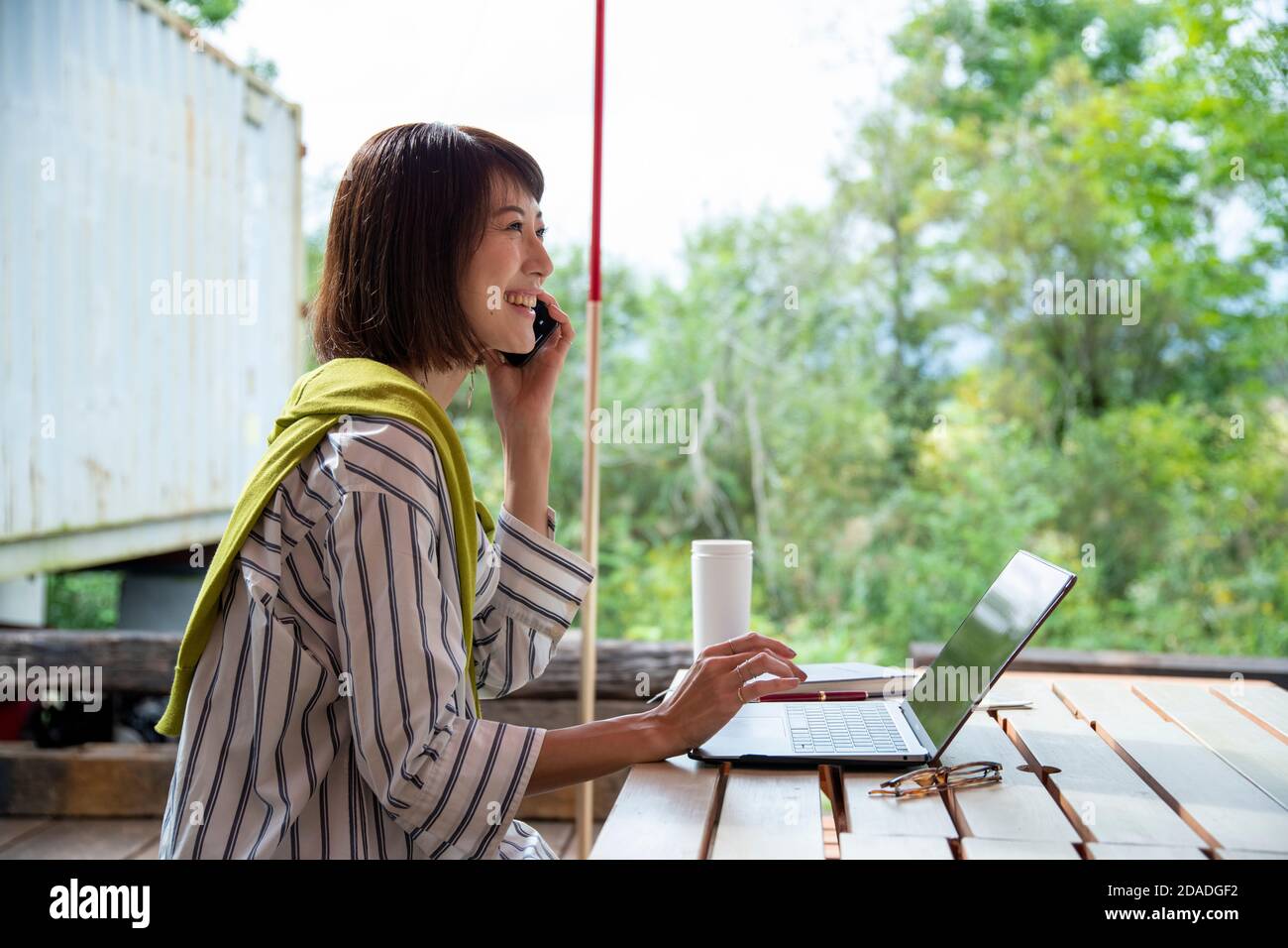 Woman Teleworking on an Outdoor Office as New Normal Work Style Stock ...