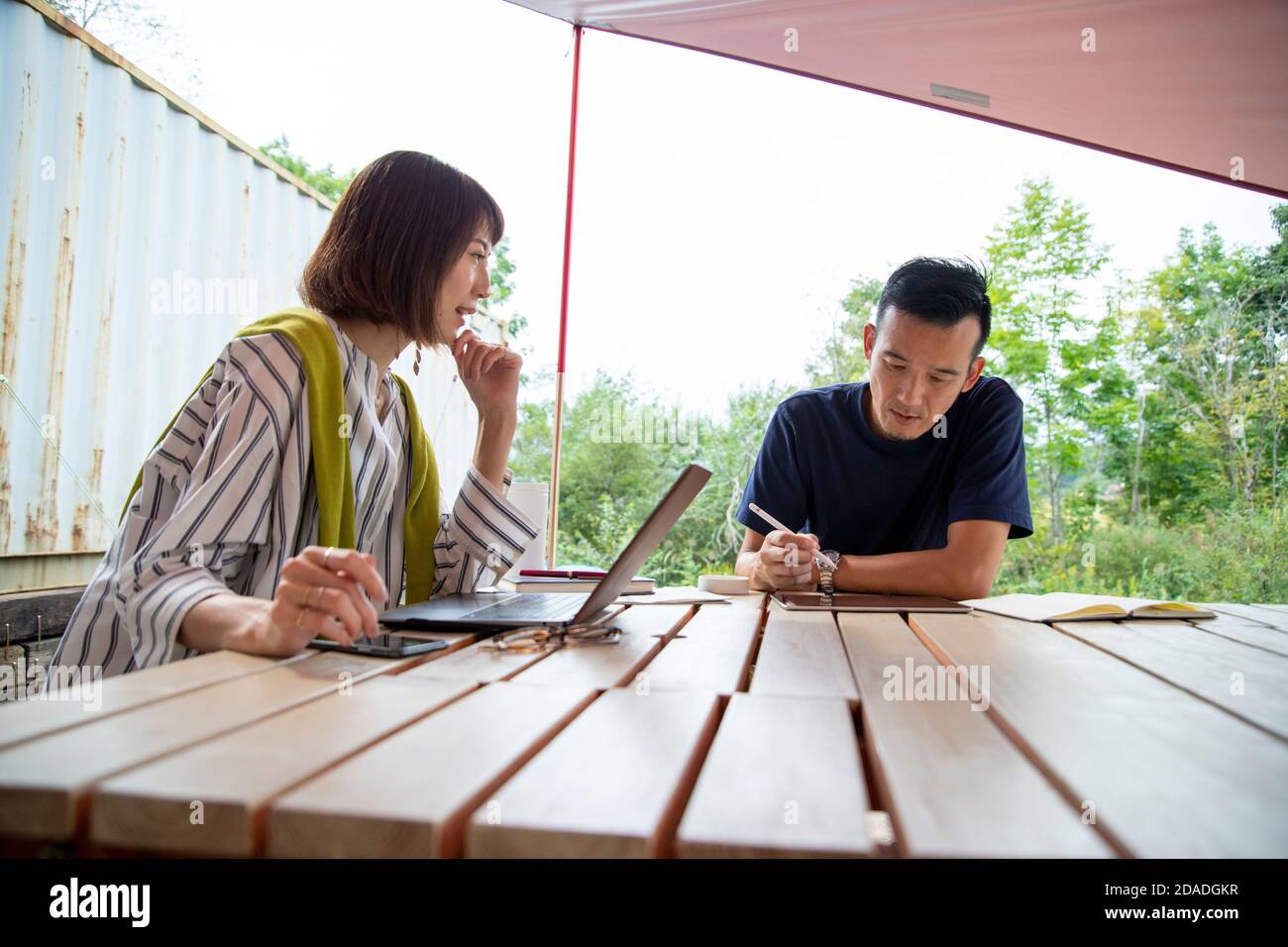 Man and Woman Having a Meeting on an Outdoor Office as New Normal Work ...