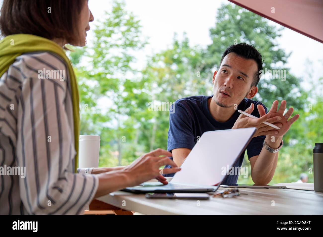 Man and Woman Having a Meeting on an Outdoor Office as New Normal Work ...